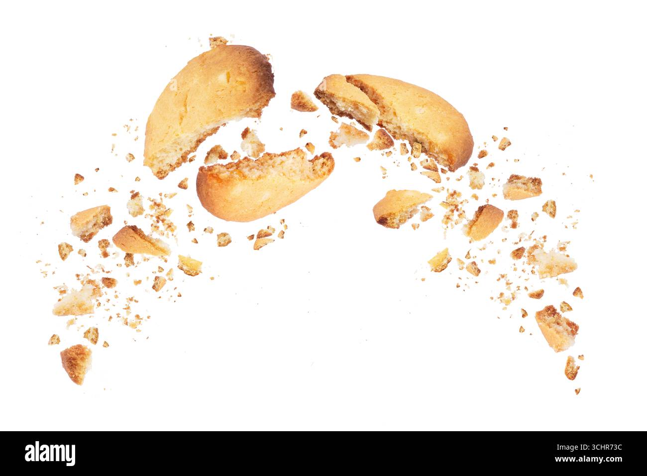 Biscuits broken into two halves with falling crumbs down, isolated on ...