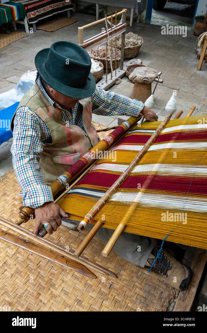 Master weaver Rafael Maldonado weaves on a backstrap loom in the ...