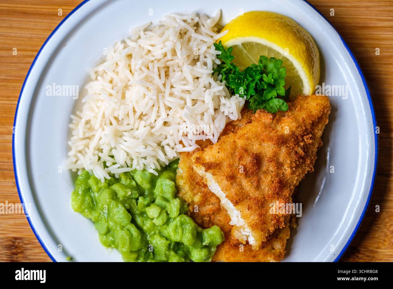 London UK, September 03 2025, Breaded Cod Fillet With Boiled White Rice ...