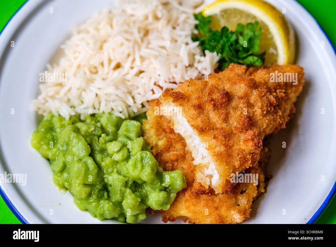 London UK, September 03 2025, Breaded Cod Fillet With Boiled White Rice ...