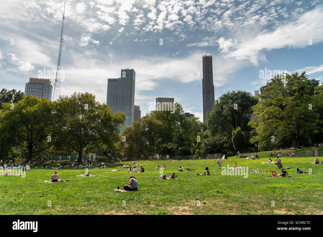 Busy lawn in Fort Greene Park in Brooklyn in New York as visitors enjoy ...
