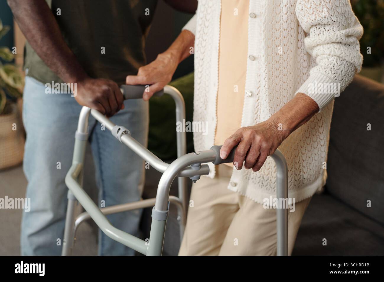 Elderly female patient gripping walker hi-res stock photography and ...