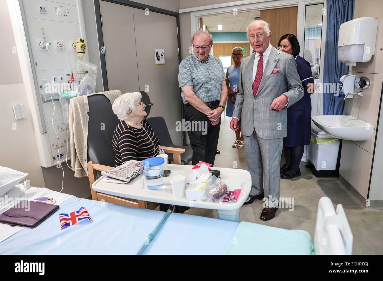 Britain's King Charles talks with patient Jacqueline Page during a ...