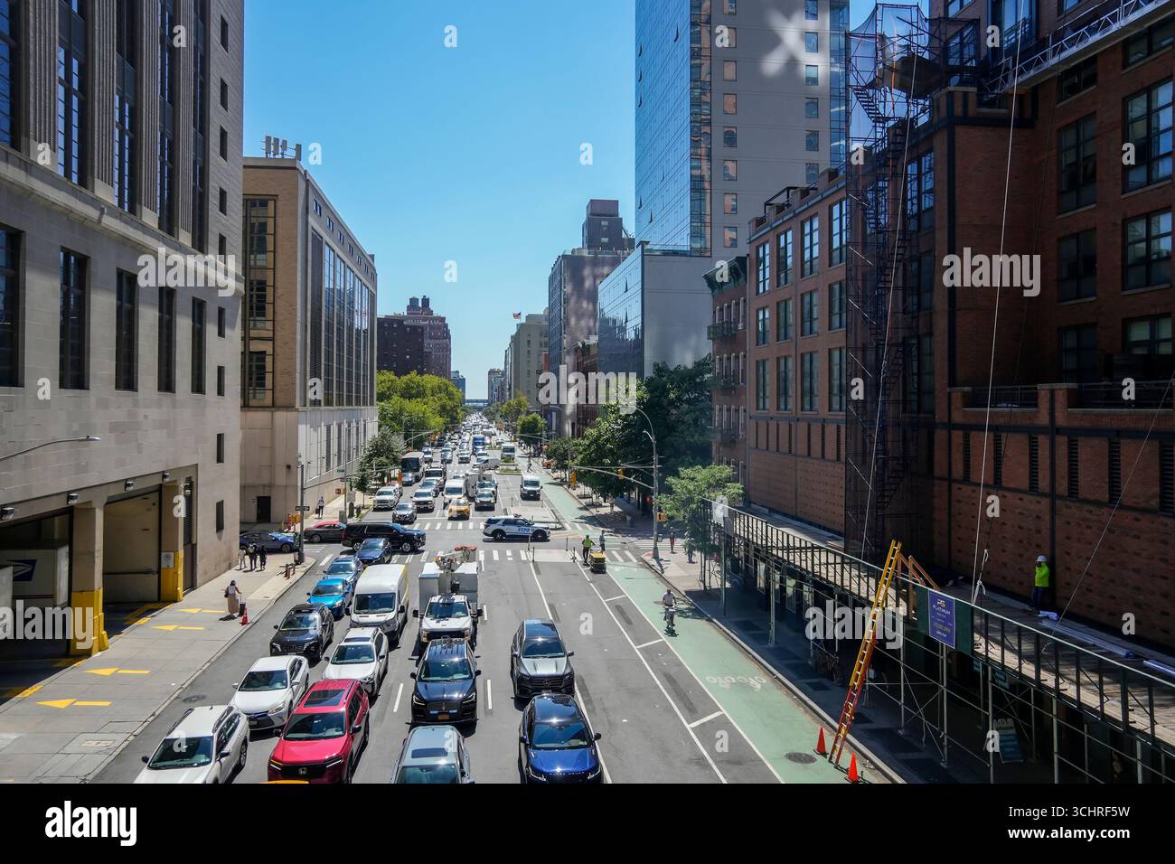 Drivers “get outta town” on Tenth Avenue in New York approaching the ...