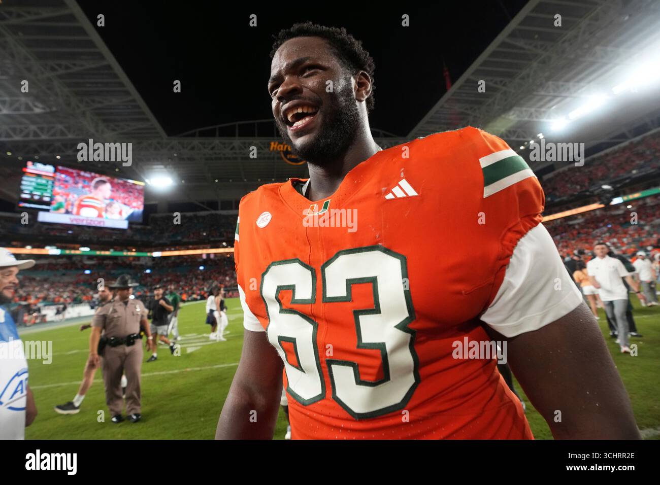 Miami offensive lineman Samson Okunlola walks off the field after Miami ...