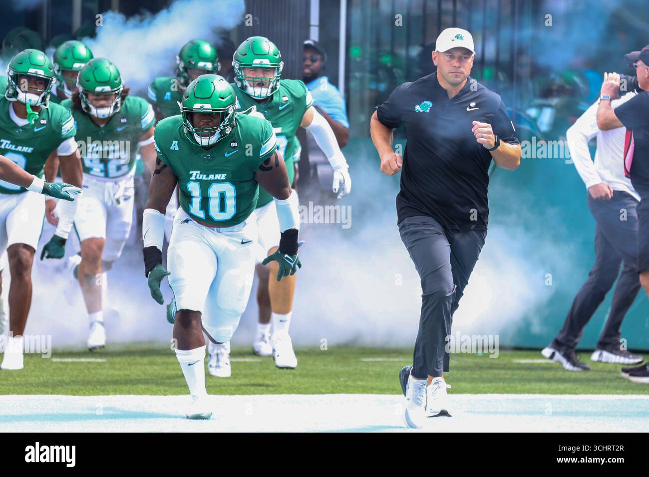 Tulane Green Wave head coach Jon Sumrall leads his team out of the ...