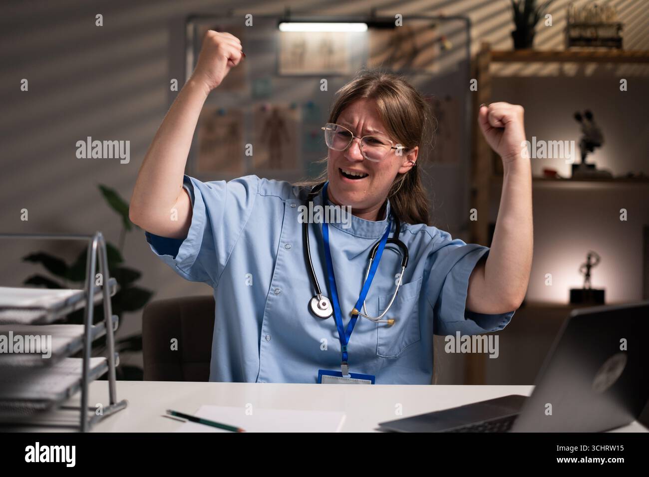 Winning success nurse working overtime on night celebrating being a ...