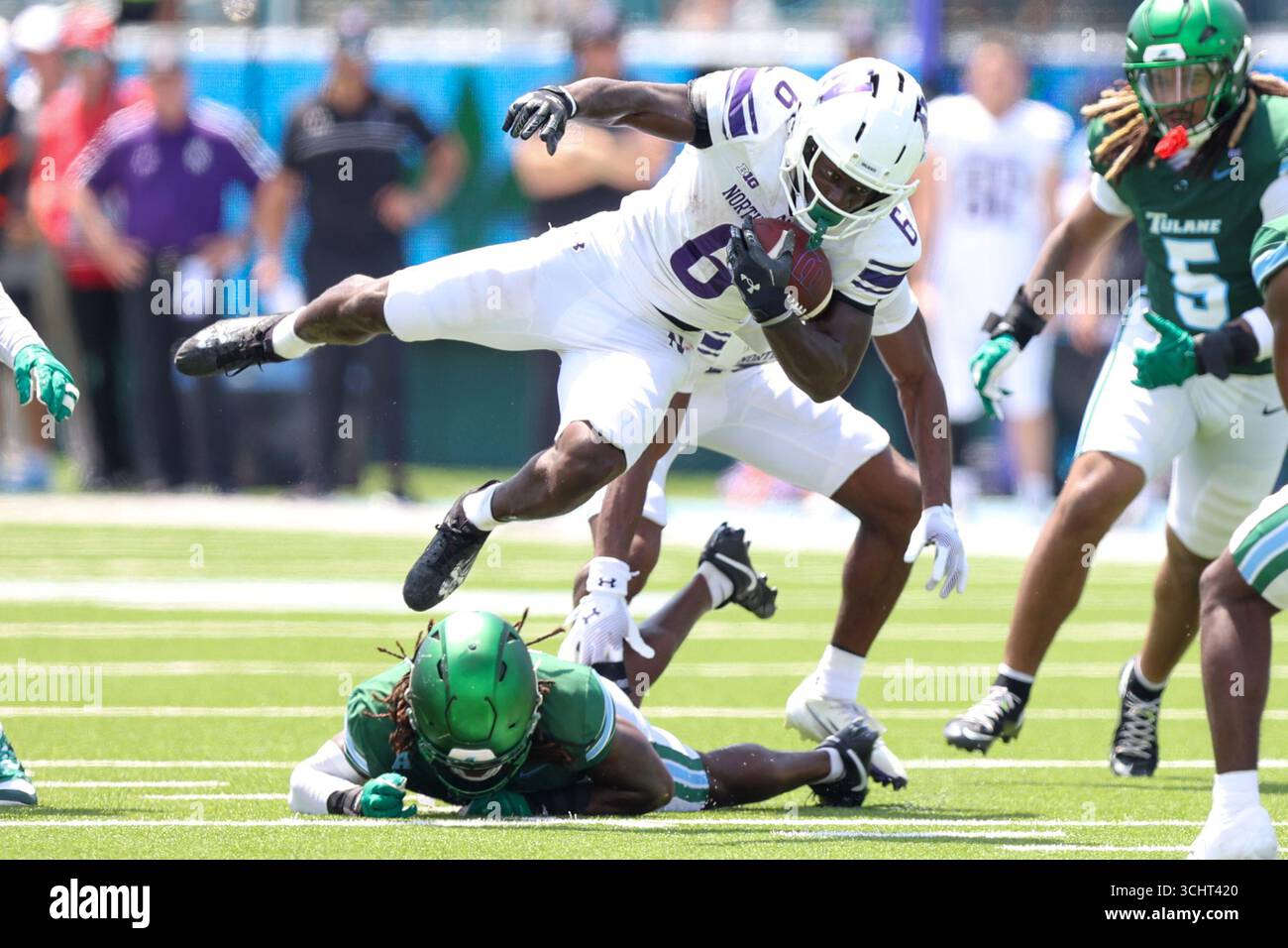Northwestern Wildcats running back Joseph Himon II (6) jumps over ...