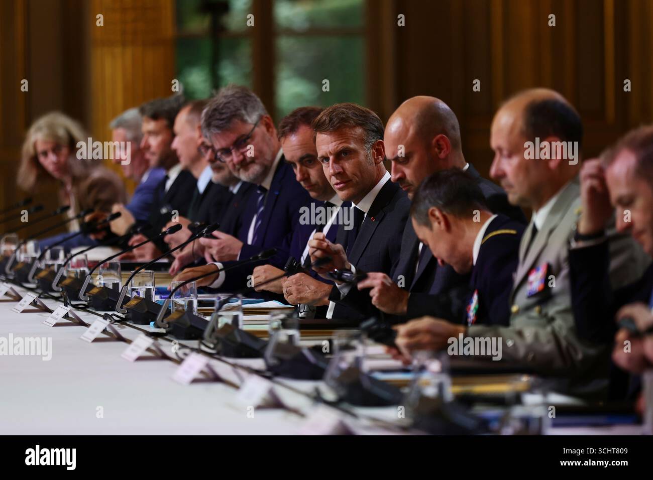 France's President Emmanuel Macron, center, attends a meeting with ...
