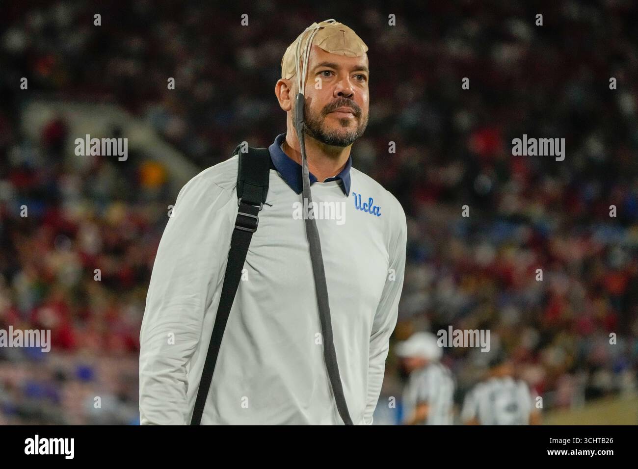 Former UCLA football player Mark Reynosa is honored on the field during ...