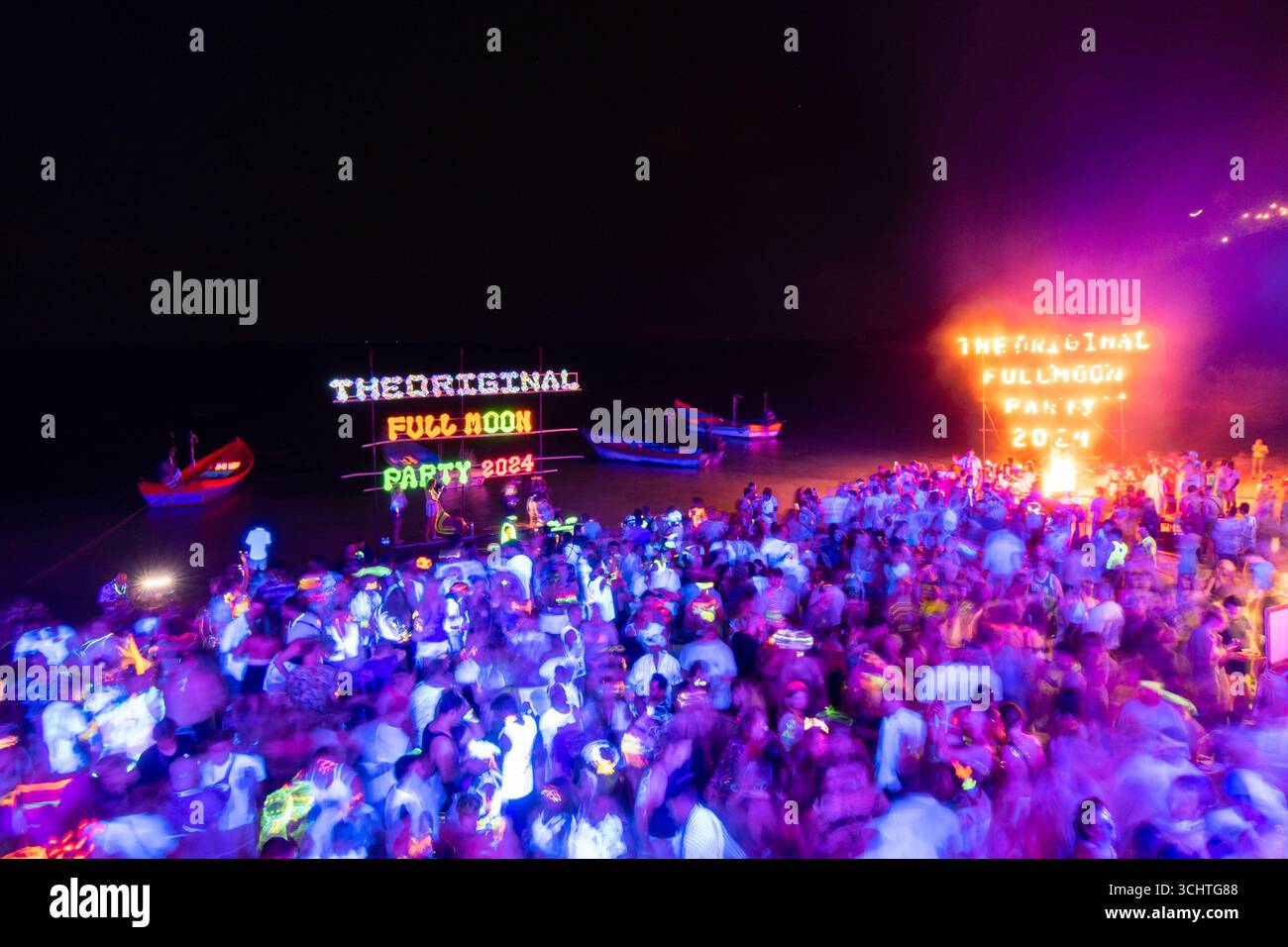 KO PHANGAN, THAILAND - Feb 11: Revellers crowd Haad Rin beach for the ...