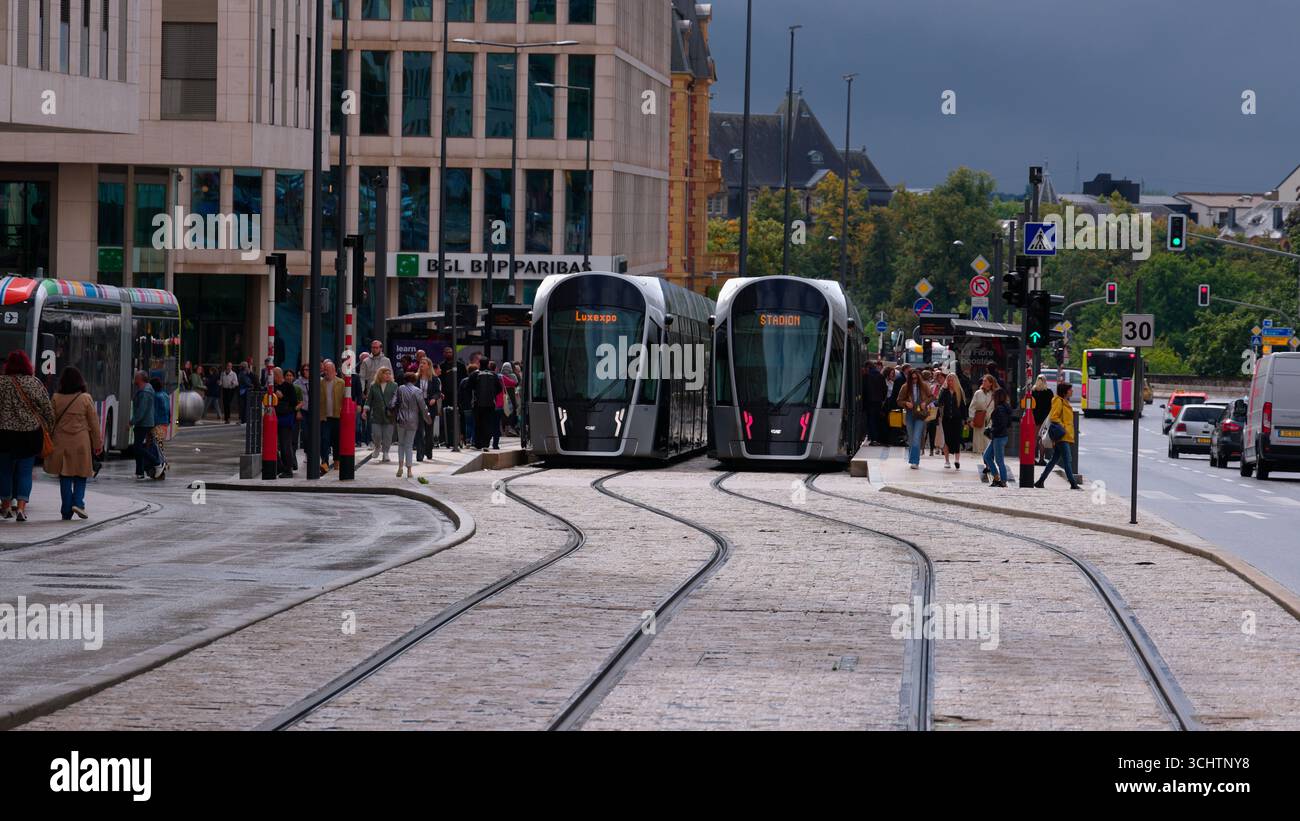 LUXEMBOURG, EUROPE - SEPTEMBER 1, 2025 - Two modern trams arriving at a ...