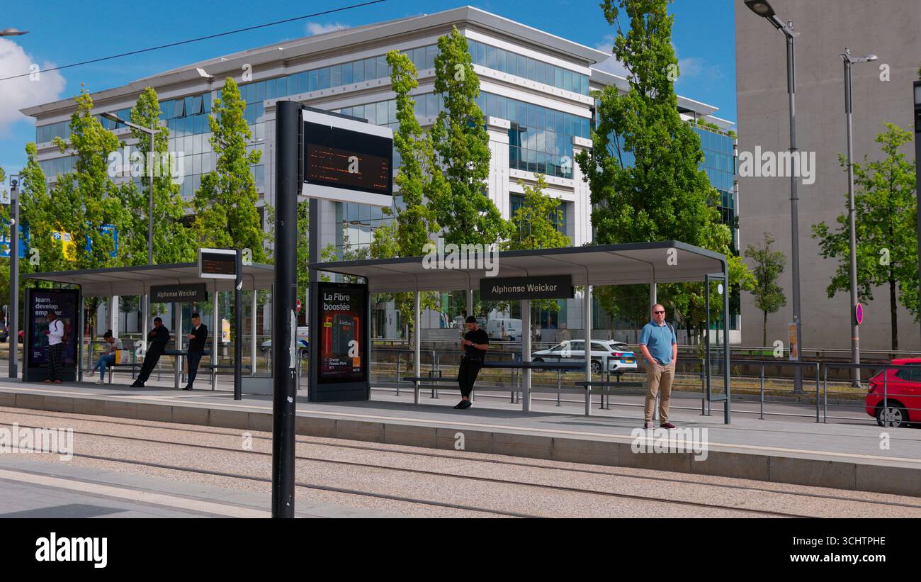 LUXEMBOURG, EUROPE - SEPTEMBER 1, 2025 - People waiting for the tram at ...