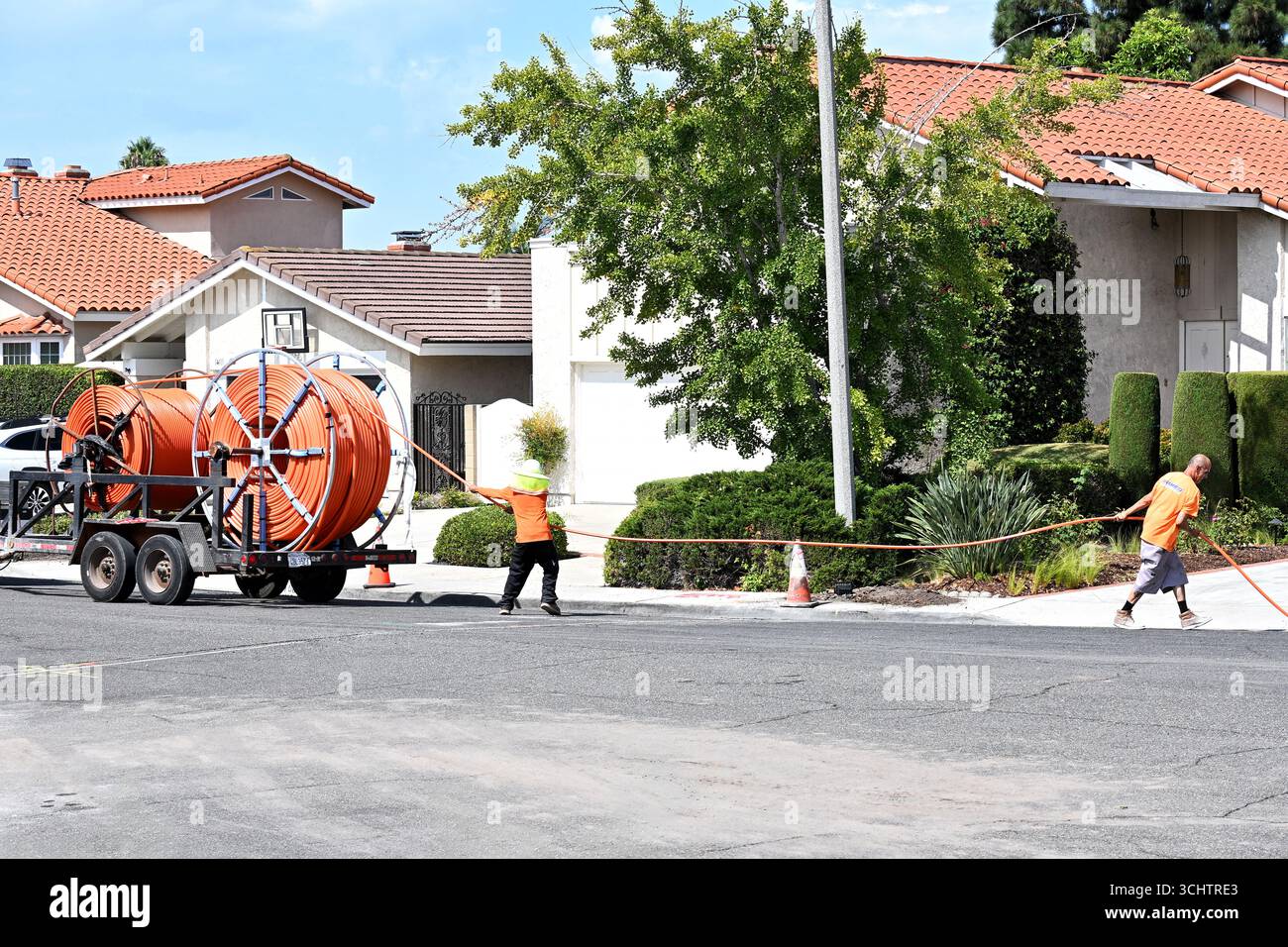 IRIVNE, CALIFORNIA - 09 SEPT 2025: Workers laying Fiber Optic Cable for ...