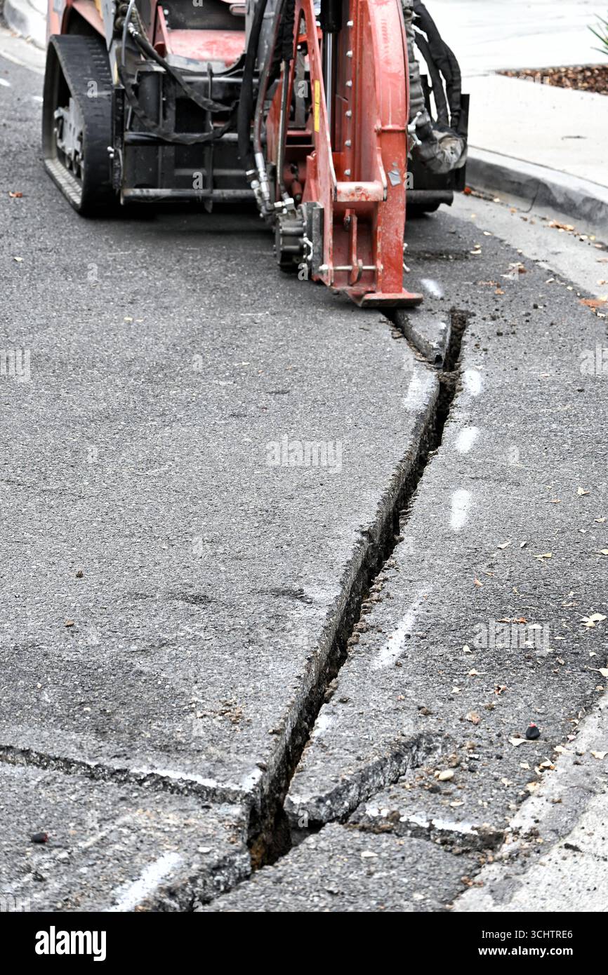 IRIVNE, CALIFORNIA - 09 SEPT 2025: A Ditch Witch Trencher cutting a ...