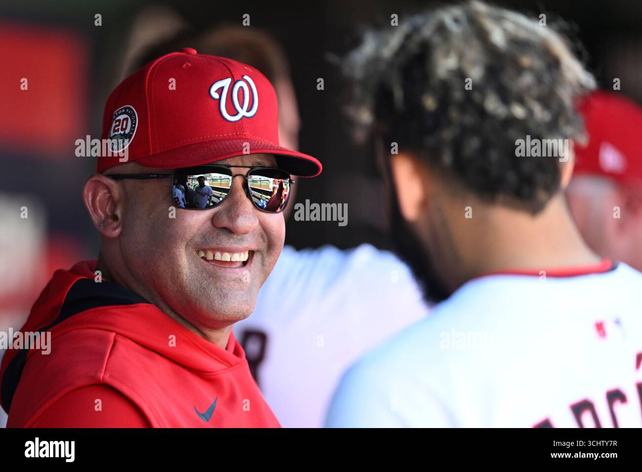 Washington Nationals interim manager Miguel Cairo, left, talks with ...