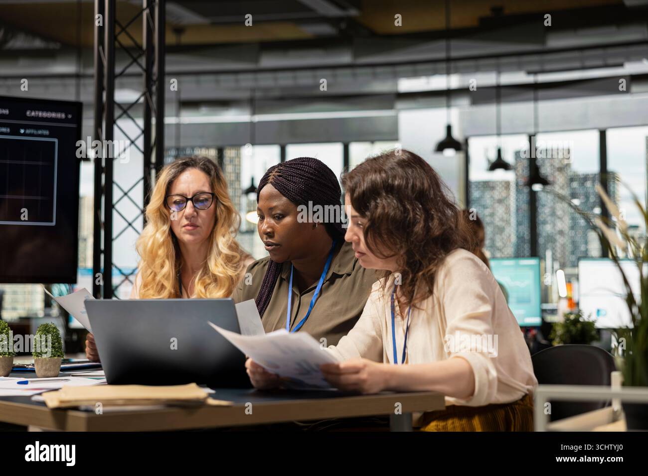 Career focused businesswomen reviewing analytics hi-res stock ...
