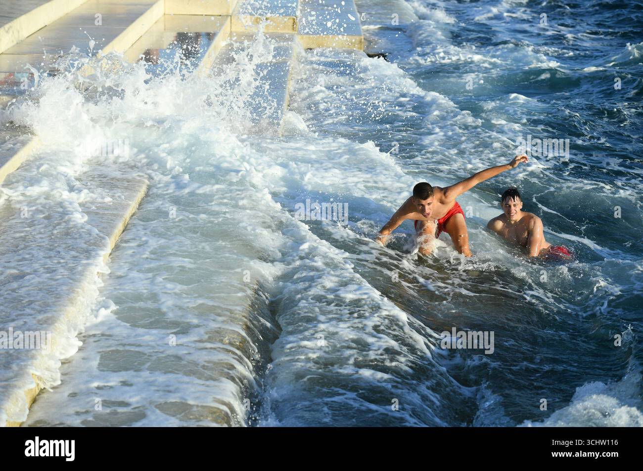 Croatia, Zadar, 030925. Tourists enjoy walking and swimming on Zadar s ...