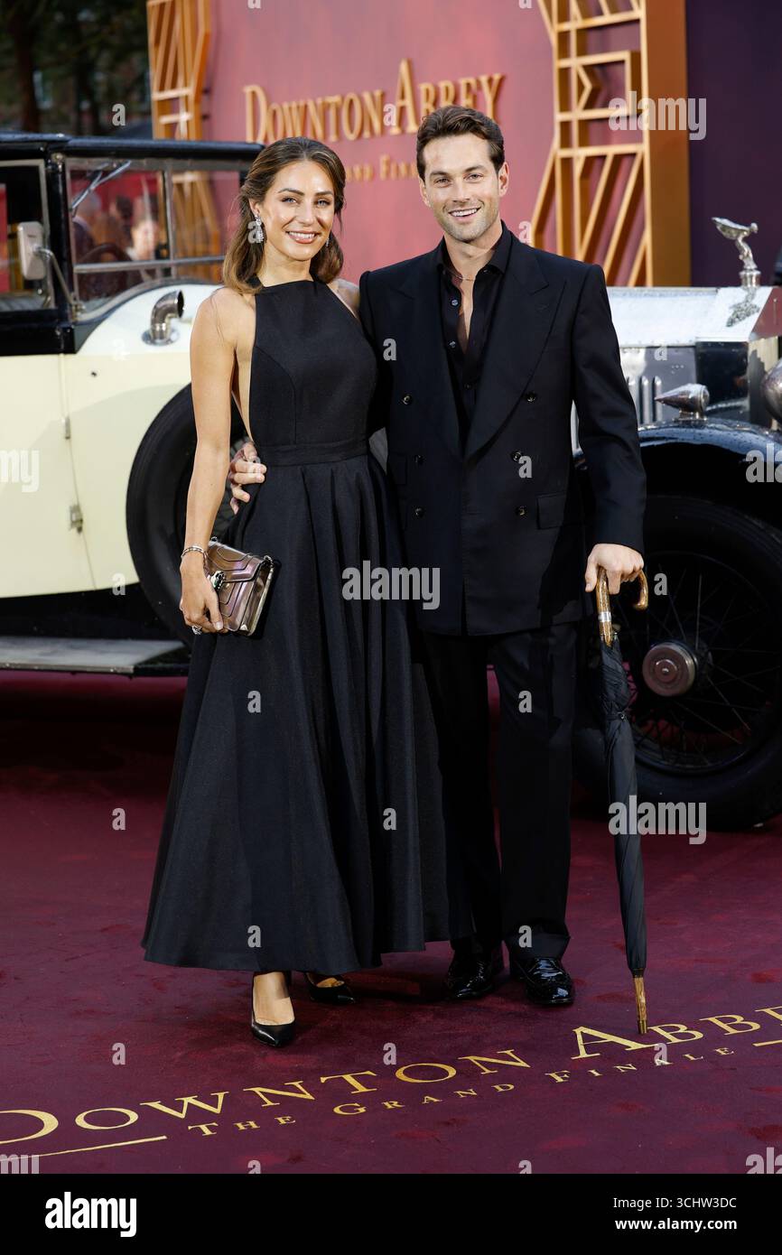 Lydia Millen, left, and Ali Gordon pose for photographers upon arrival ...