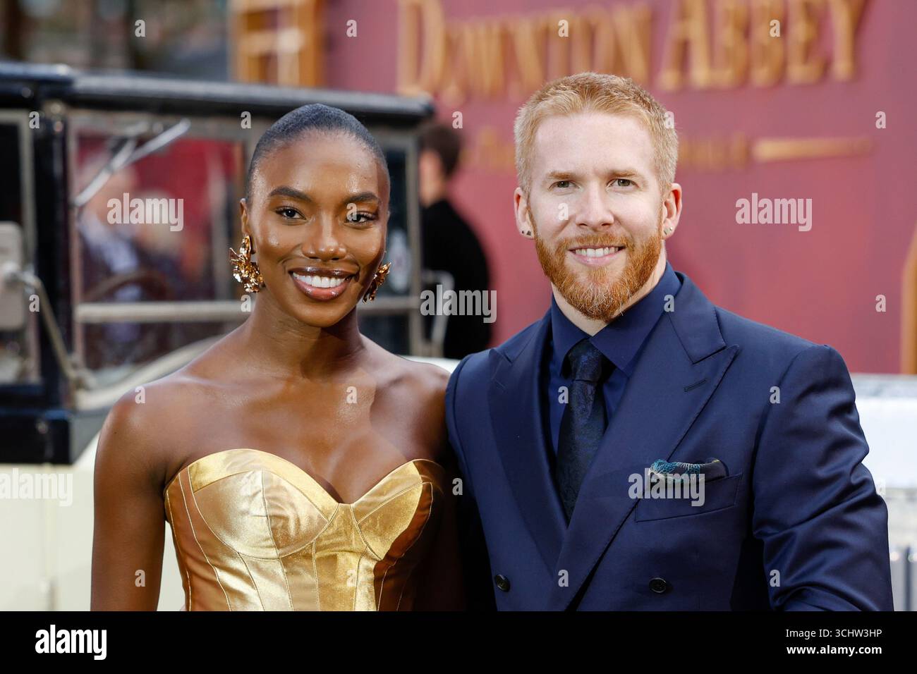 Chyna Mills, left, and Neil Jones pose for photographers upon arrival ...