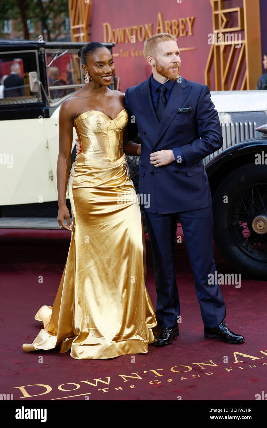 Chyna Mills, left, and Neil Jones pose for photographers upon arrival ...