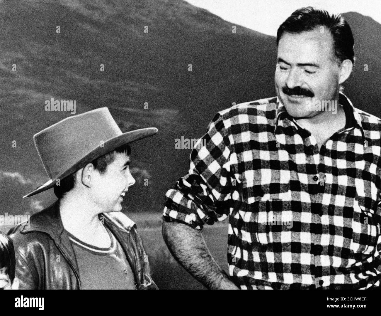 FILE - Patrick Hemingway, left, looks at his father, Ernest Hemingway ...