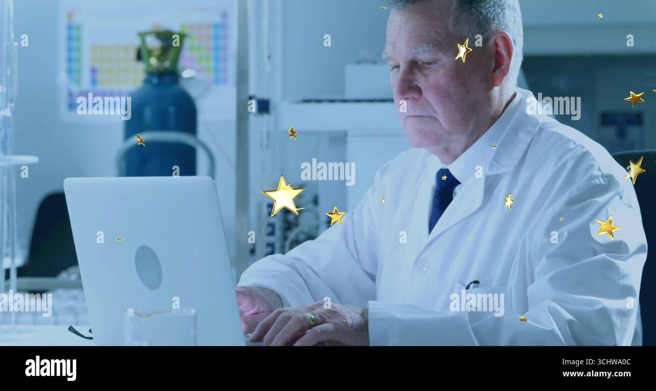 Typing senior scientist wearing lab coat and tie at laboratory bench ...