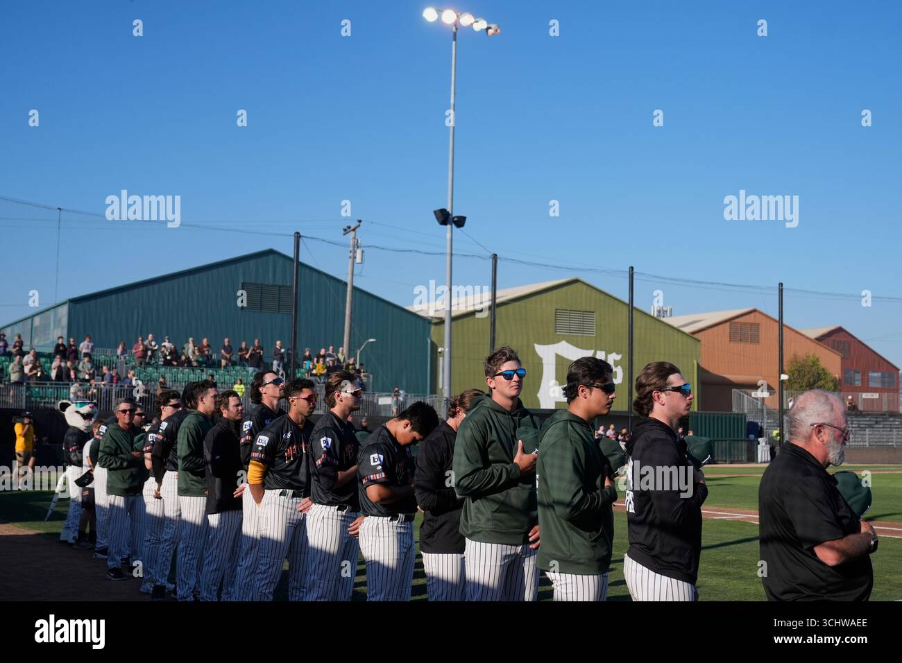 FILE - Oakland Ballers players stand during the national anthem before ...