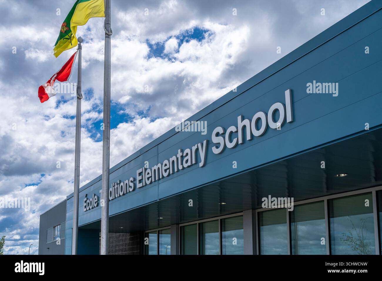 Ground-level photo capturing the modern front entrance of École ...