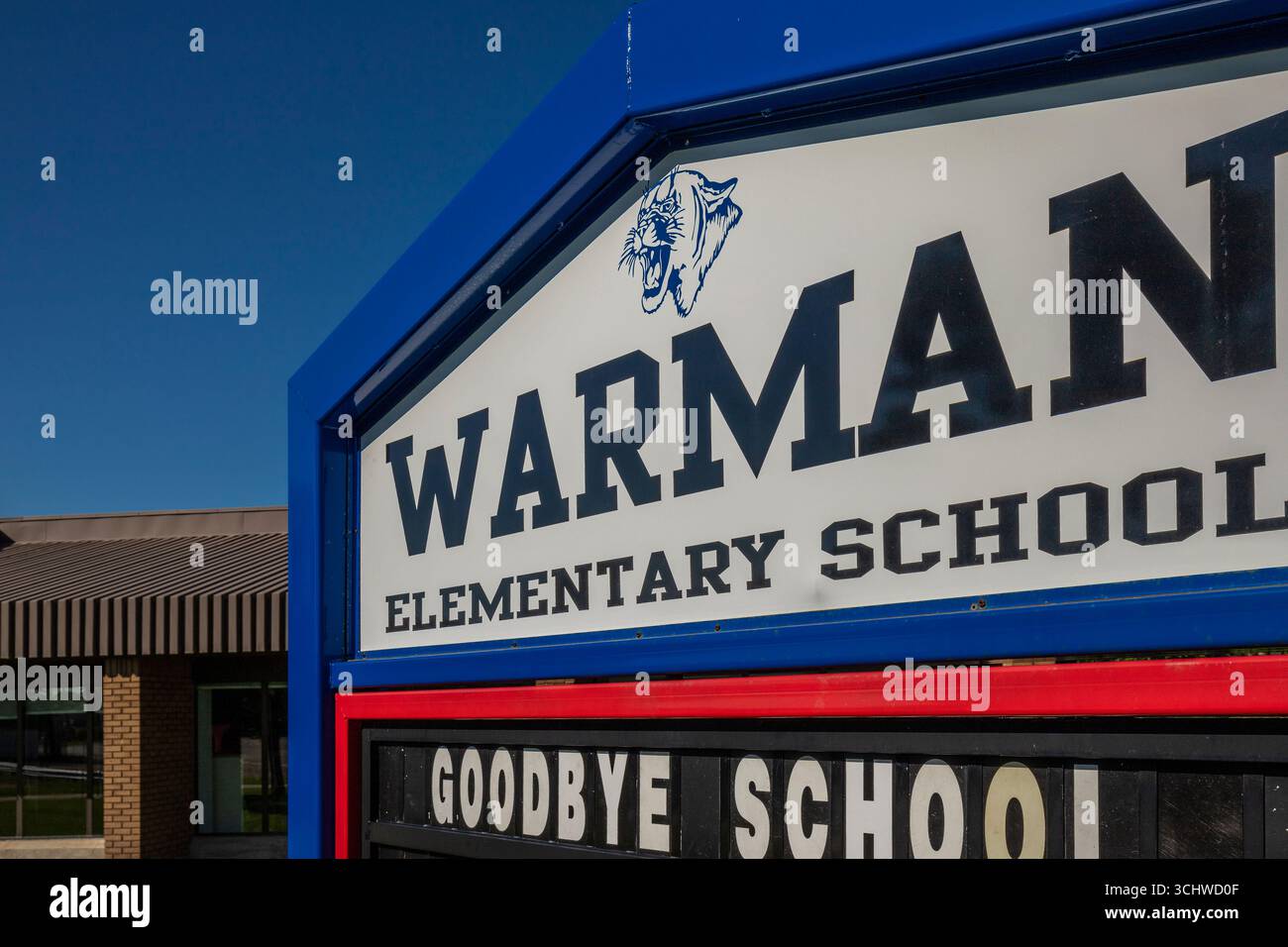 Ground-level photo of Warman Elementary School’s front entrance. The ...