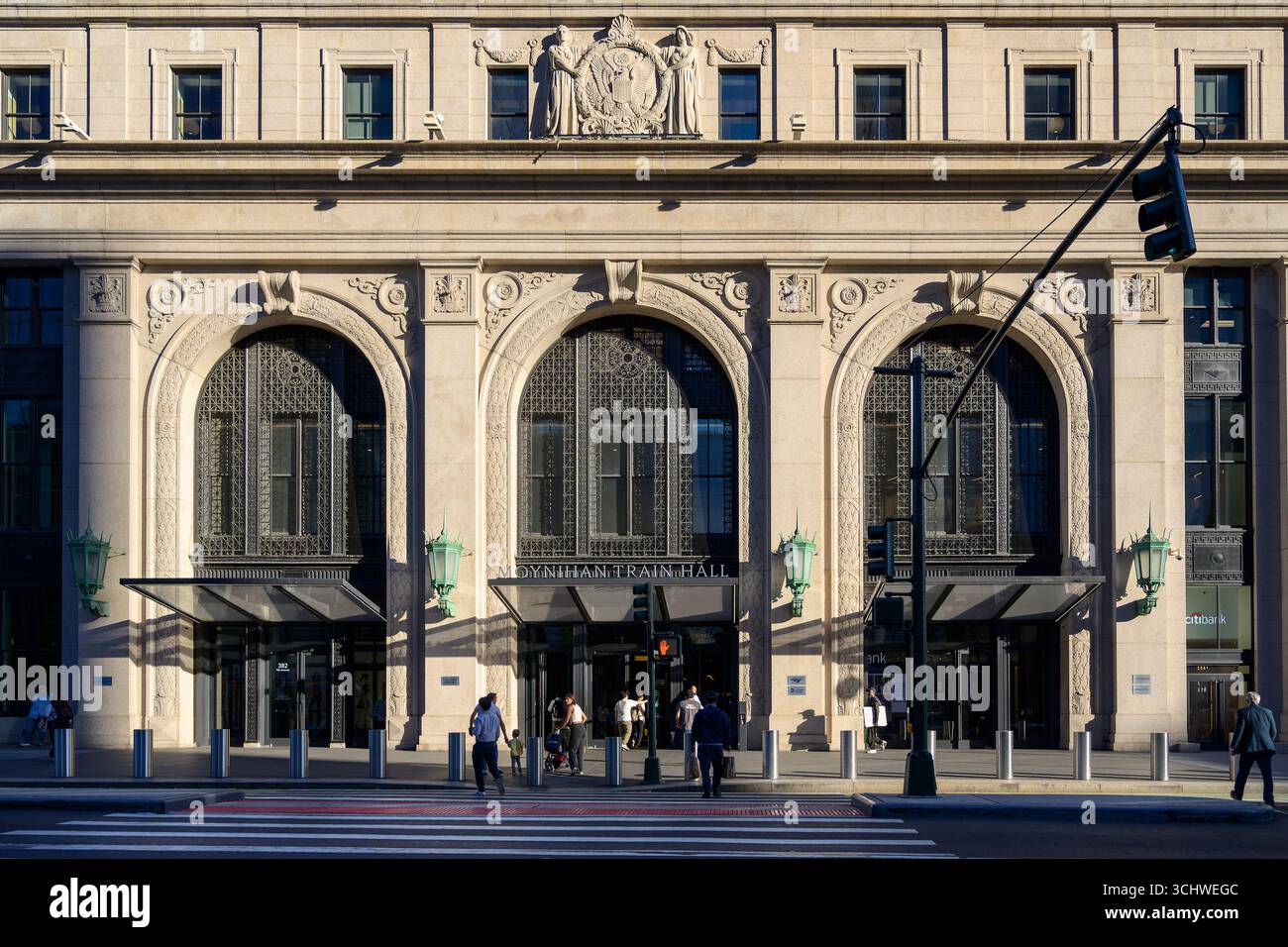 View of the historic facade of Moynihan Train Hall, pedestrians ...