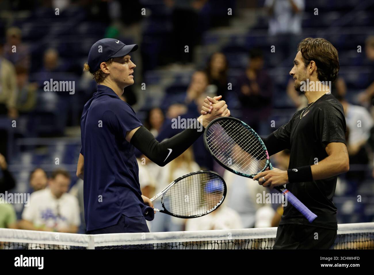 Jannik Sinner, left, of Italy, shakes hands with Lorenzo Musetti, of Italy, after defeating him ...