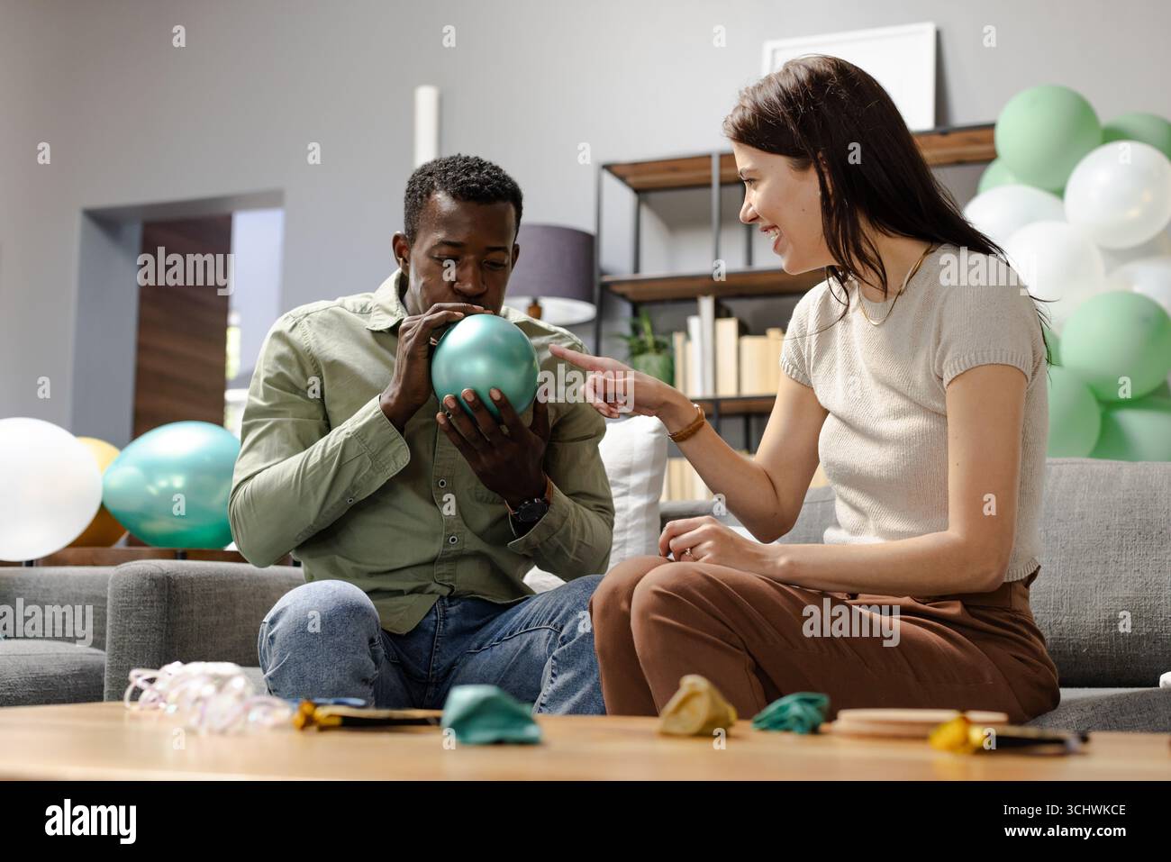 Man inflating balloon hi-res stock photography and images - Alamy