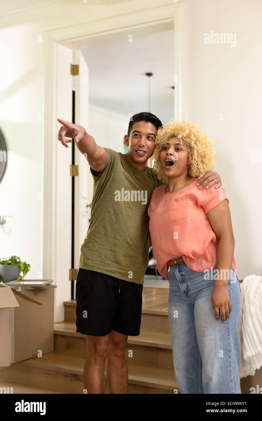 Young diverse couple unpacking boxes hi-res stock photography and images - Alamy