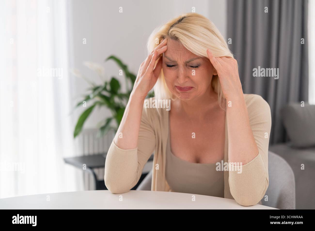 Middle aged emotional woman tears hi-res stock photography and images ...