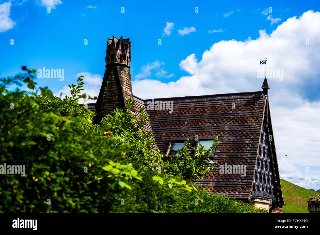 Picturesque English Cottage Rooftop with Steep Gables, Weather Vane ...