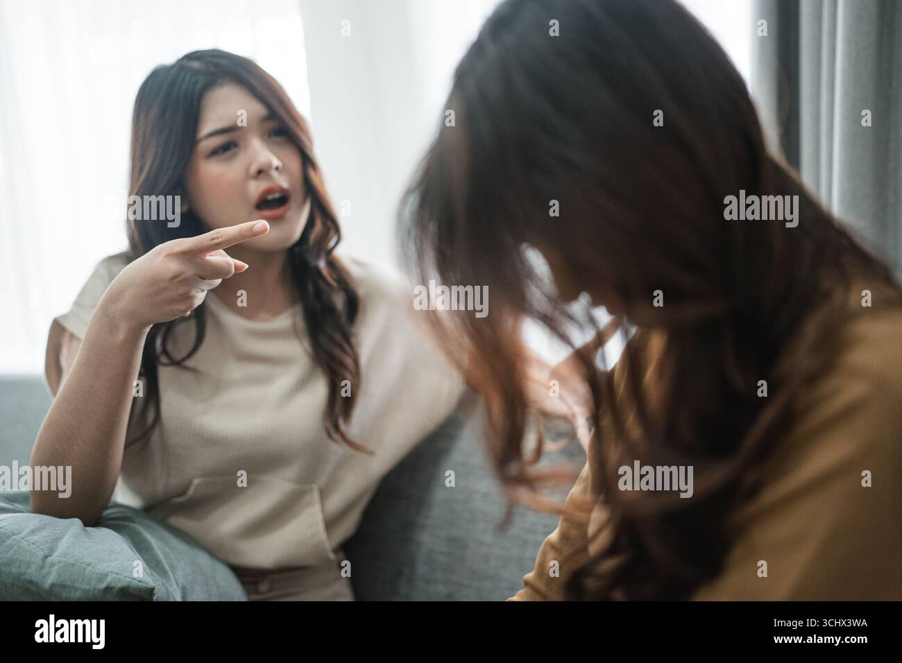 Emotional Conversation Between Two Women in Modern Living Room Setting ...
