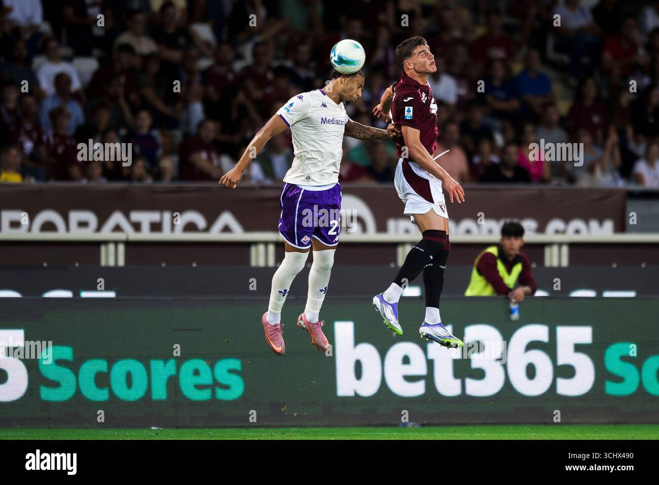 Cher Ndour of ACF Fiorentina competes for a header with Cesare Casadei ...