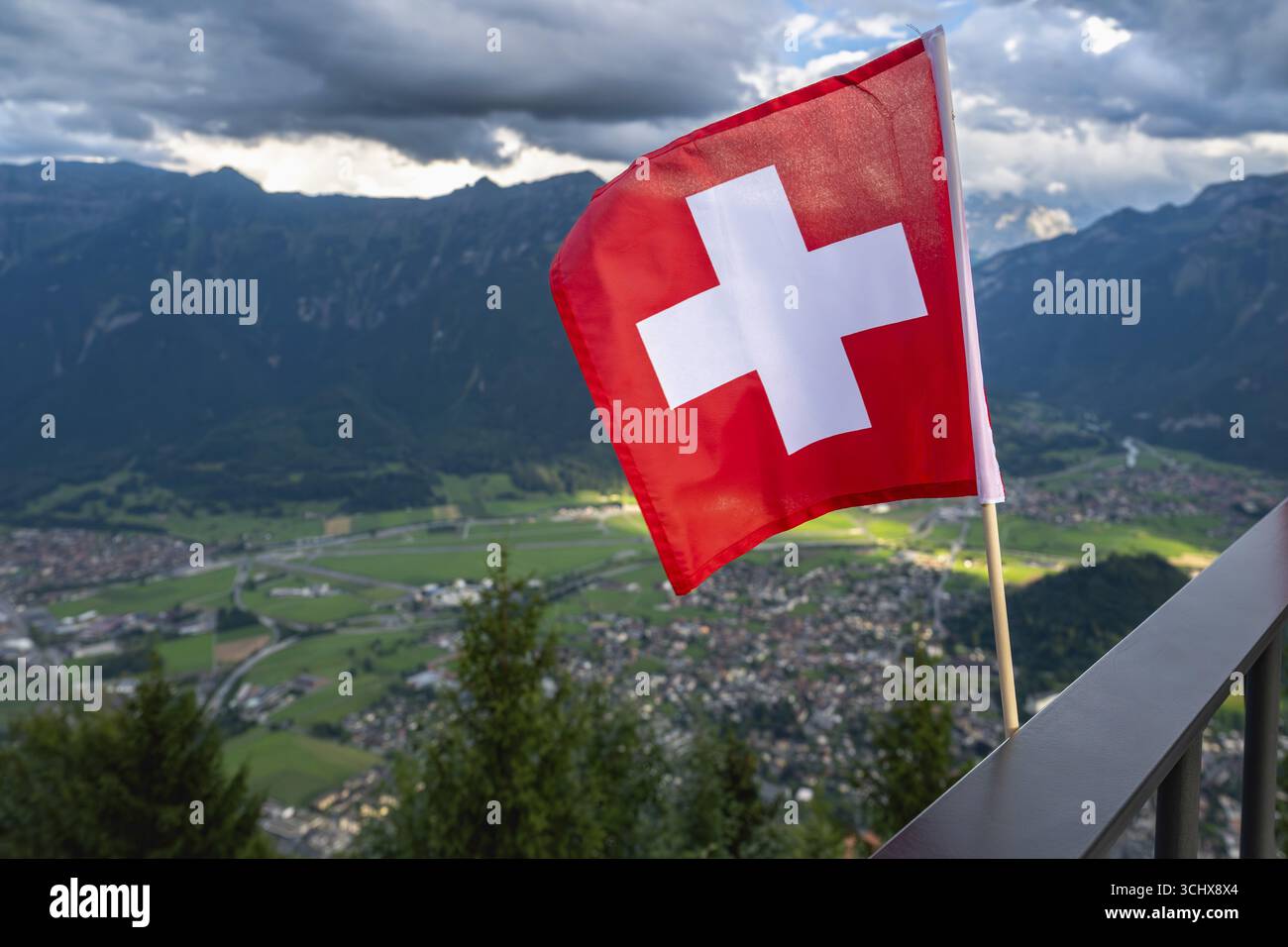 Swiss flag, Interlaken, Switzerland Stock Photo - Alamy