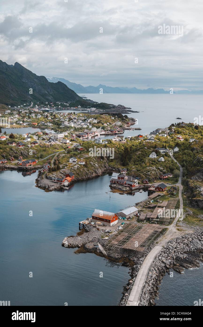 Aerial view of a small town nestled amidst rugged mountains and serene ...