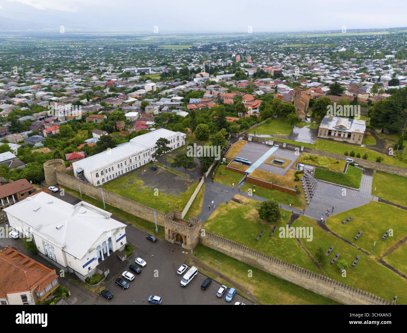 Historic walls and buildings with neighbouring trees in an urban ...