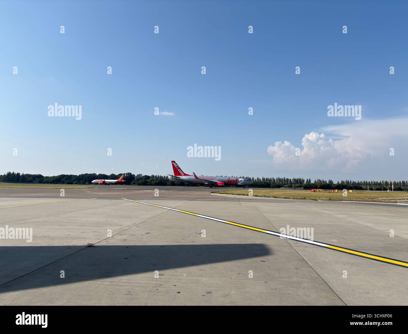 Airplanes on the runway at Edinburgh Airport, showcasing aviation ...