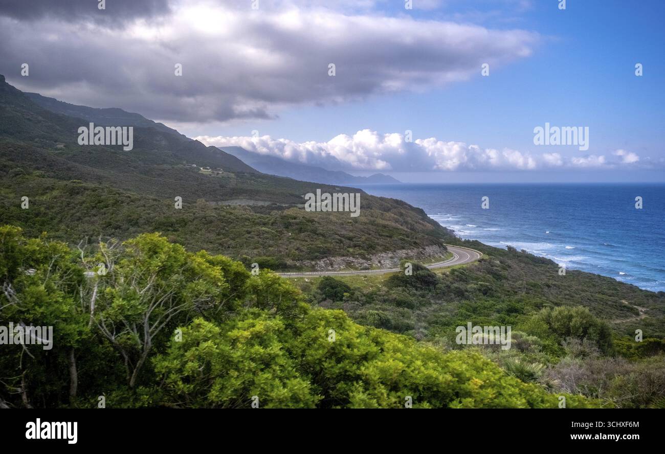 Sardinia, coastal road, mountains, sea, blue sky with clouds, Villanova ...