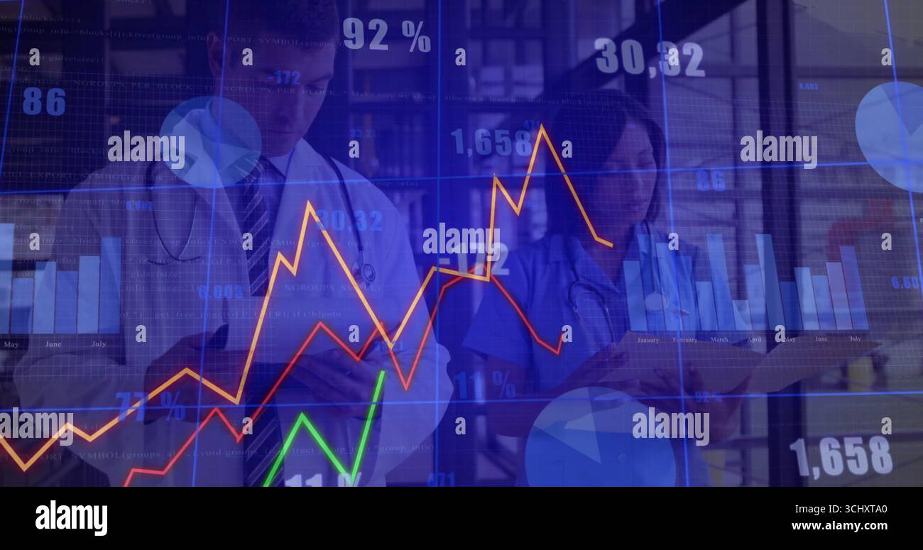 Two medical professionals analyzing digital charts in clinical office ...