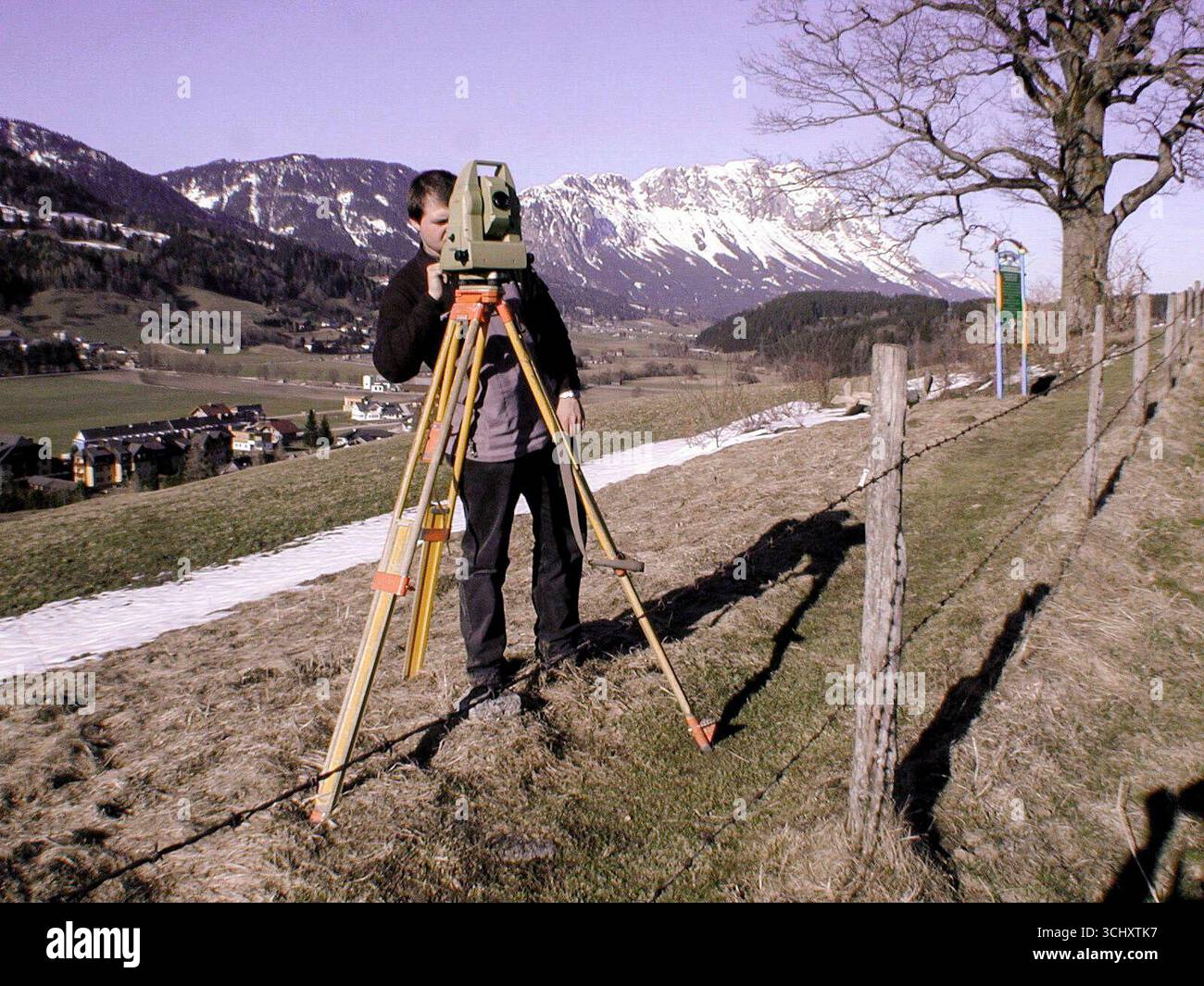 surveying by a land surveyor with measure instruments in geodesy ...