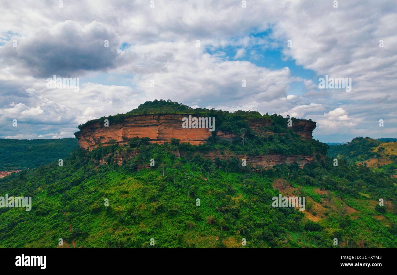 Aerial view of Atwea Mountain's majestic plateau rises amidst a sea of ...