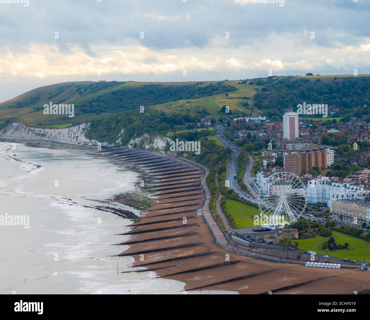 Aerial view of the coastline with its groynes, the iconic white cliffs ...