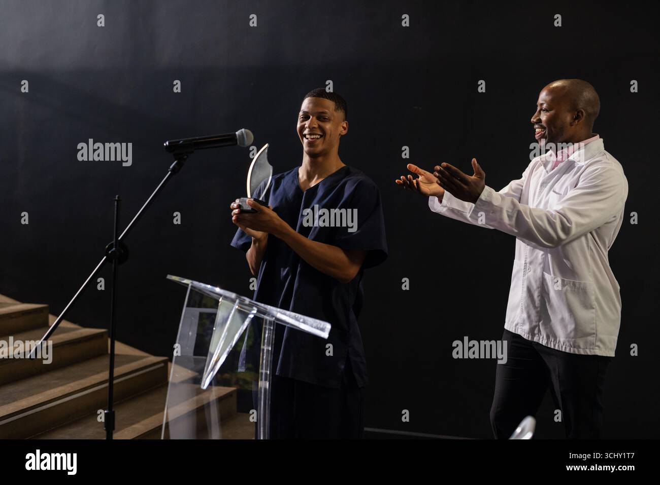 Man at awards ceremony clapping hi-res stock photography and images - Alamy