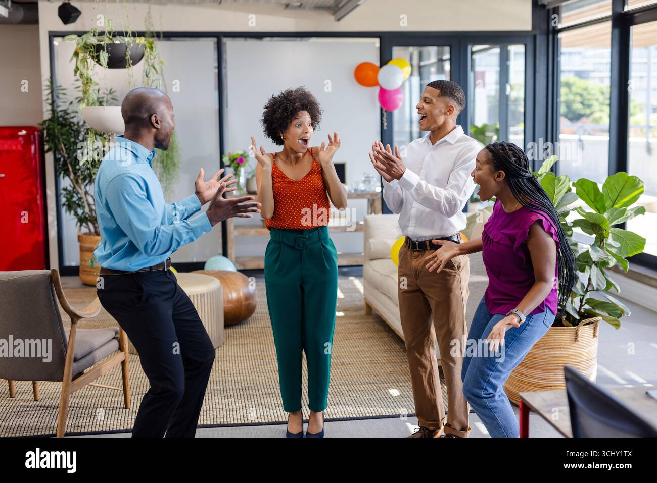 Celebrating success, African American colleagues expressing excitement and joy in office Stock ...