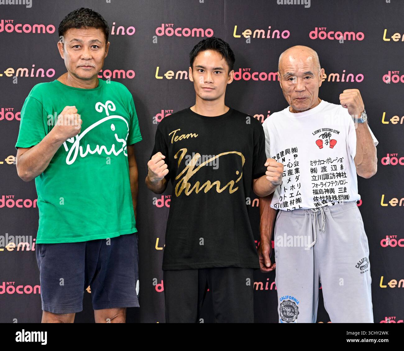Yuni Takada (center) of Japan, poses with his trainer Toshiya Watanabe ...
